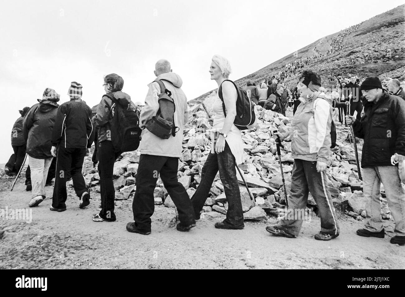 Black and white film footage of "Reek Sunday", a guelling pilgrimage up ...