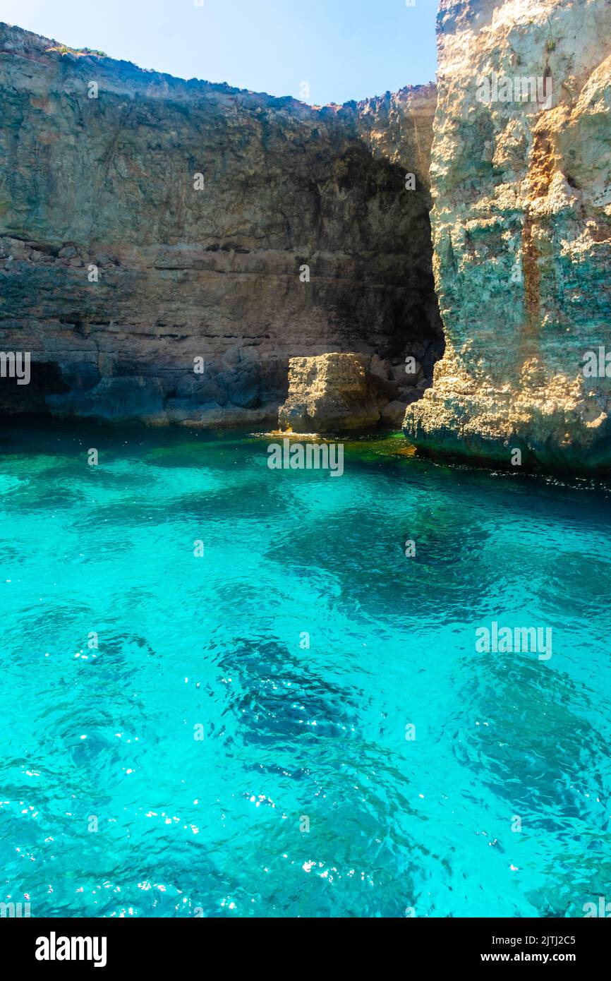 Crystal clear water under the cliffs of Malta Stock Photo - Alamy