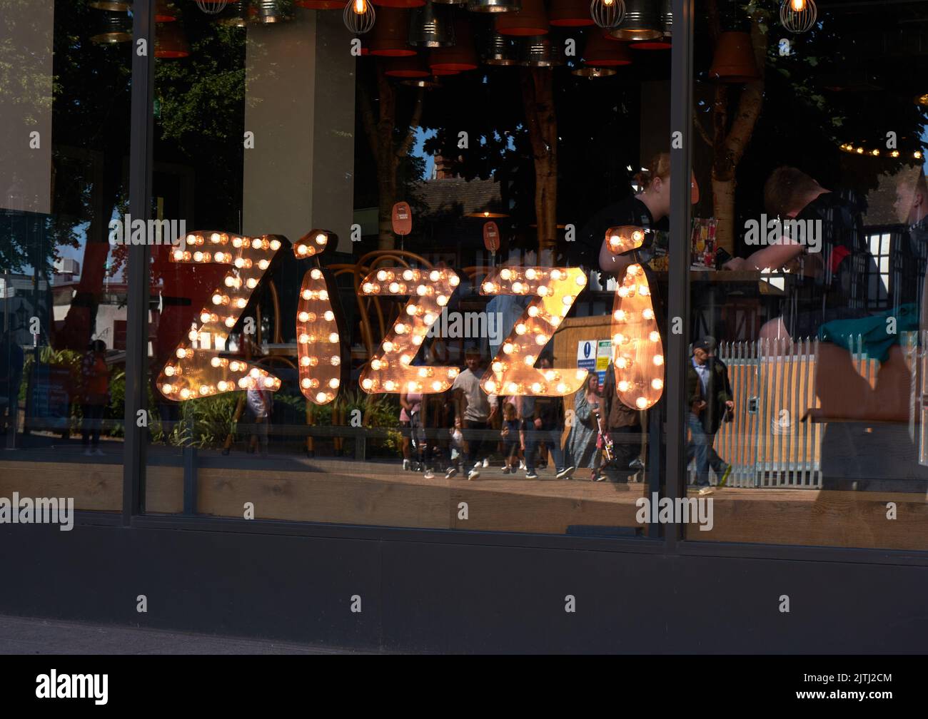 Modern restaurant name in neon lights Stock Photo - Alamy