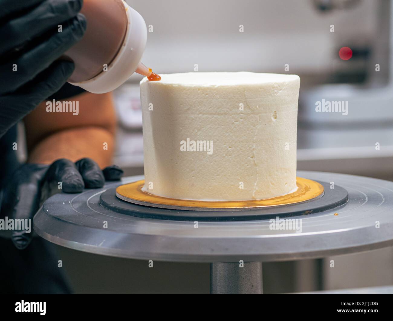 Chef decorating cake caramel cream hi-res stock photography and images ...