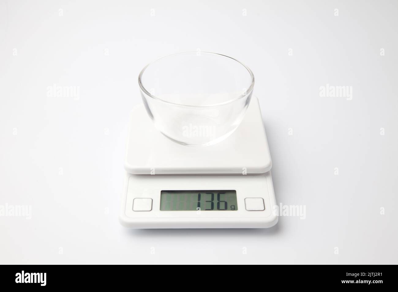 glass bowl on electronic weighing instrument isolated on white ...