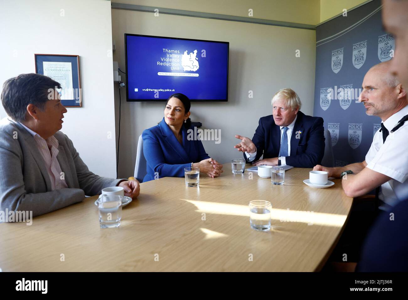 Prime Minister Boris Johnson (centre) and Home Secretary Priti Patel ...