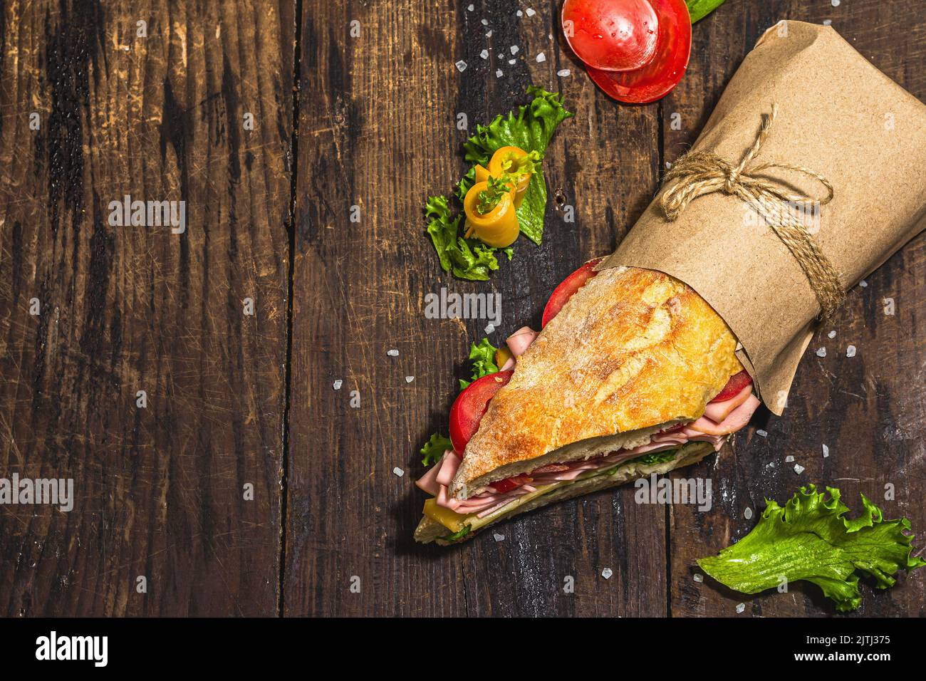 Panini sandwich with ham, crispy salad and vegetables. Healthy food to ...