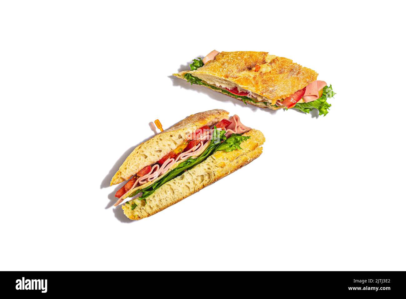Panini sandwich with ham, crispy salad and vegetables isolated on white ...