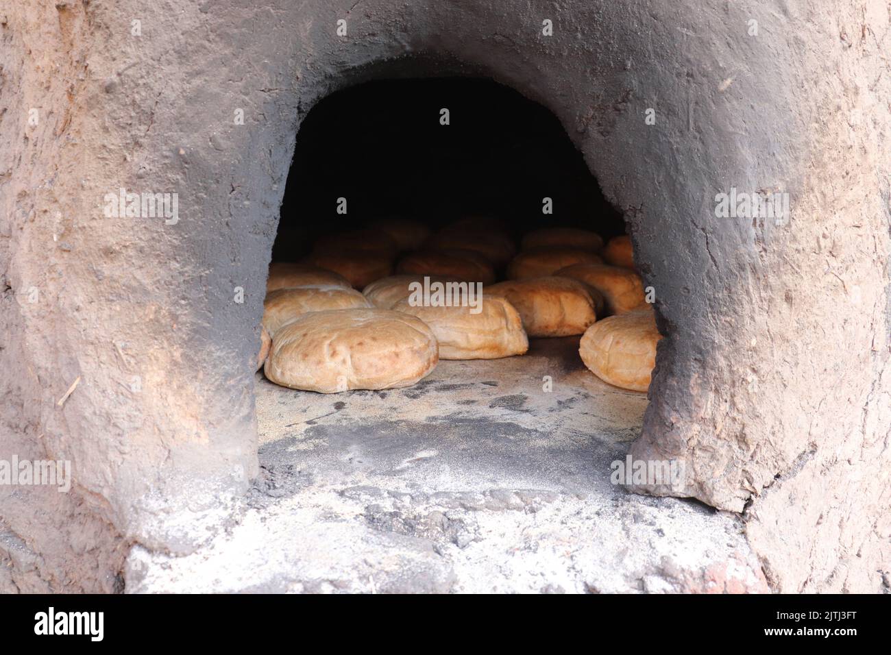 Egyptian Sun bread (In Arabic: Eish Shamsy) inside a traditional mud ...