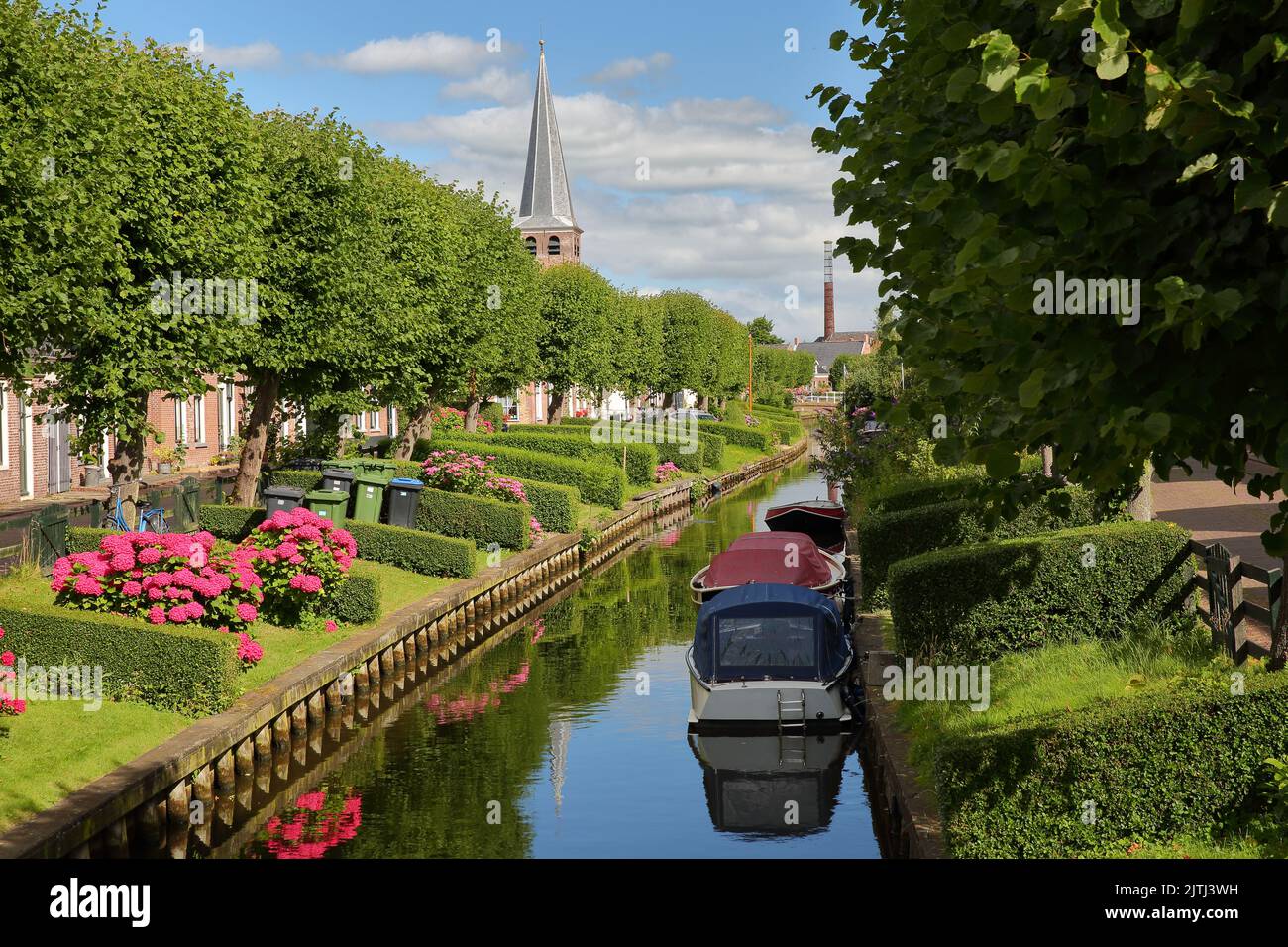 Eegracht canal surrounded by beautiful gardens in IJlst, Friesland ...