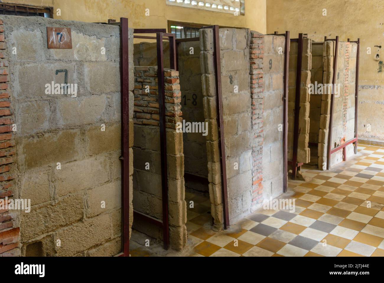 Cramped brick cells at the Tuol Sleng Genocide Museum, Phnom Penh ...