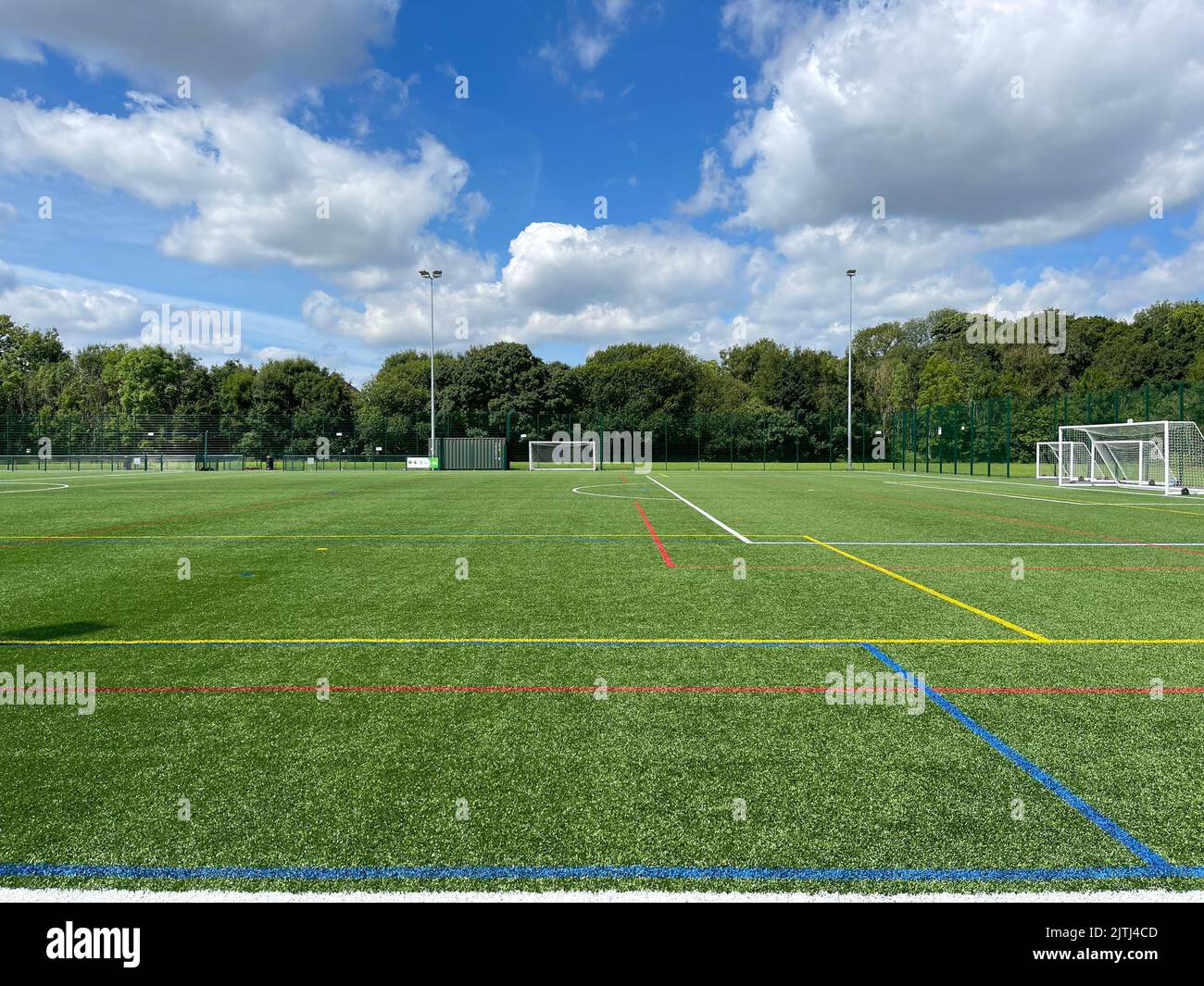 An artificial football field with colorful lines and nets Stock Photo ...