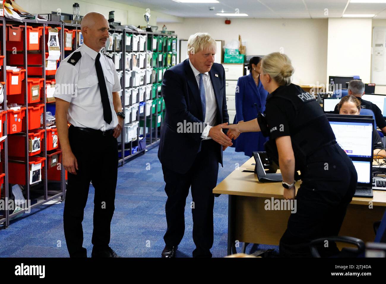 Prime Minister Boris Johnson walks with Superintendent Marc Tarbit ...