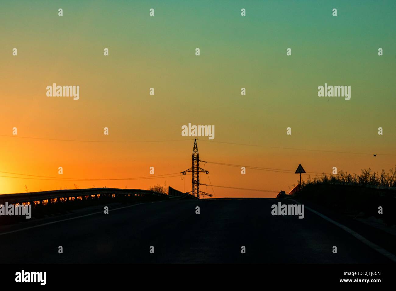 Electric power pylon, electric tower at sunset Stock Photo - Alamy