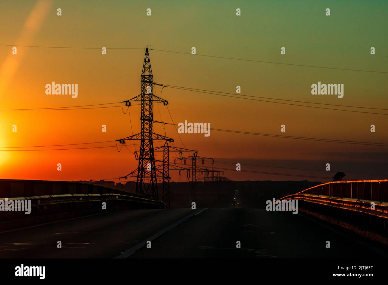 Electric power pylon, electric tower at sunset Stock Photo - Alamy
