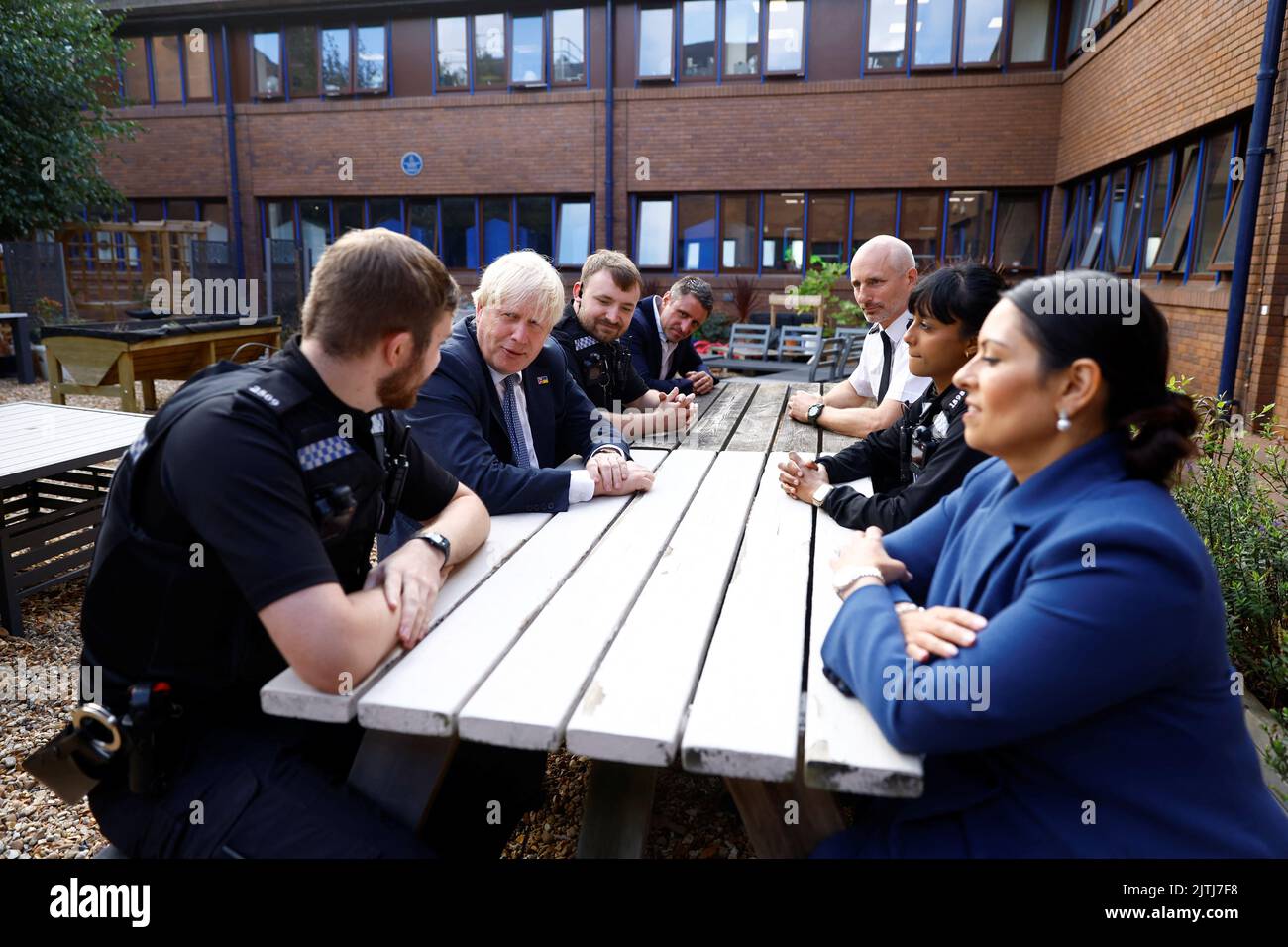 Prime Minister Boris Johnson (second left) and Home Secretary Priti ...