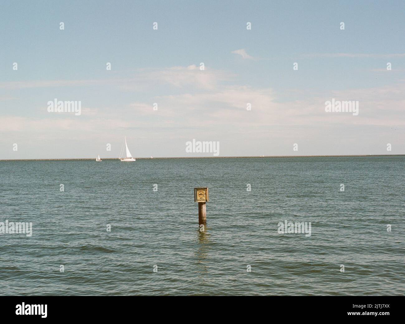 The view of the bay with a no boating sign in the water Stock Photo - Alamy