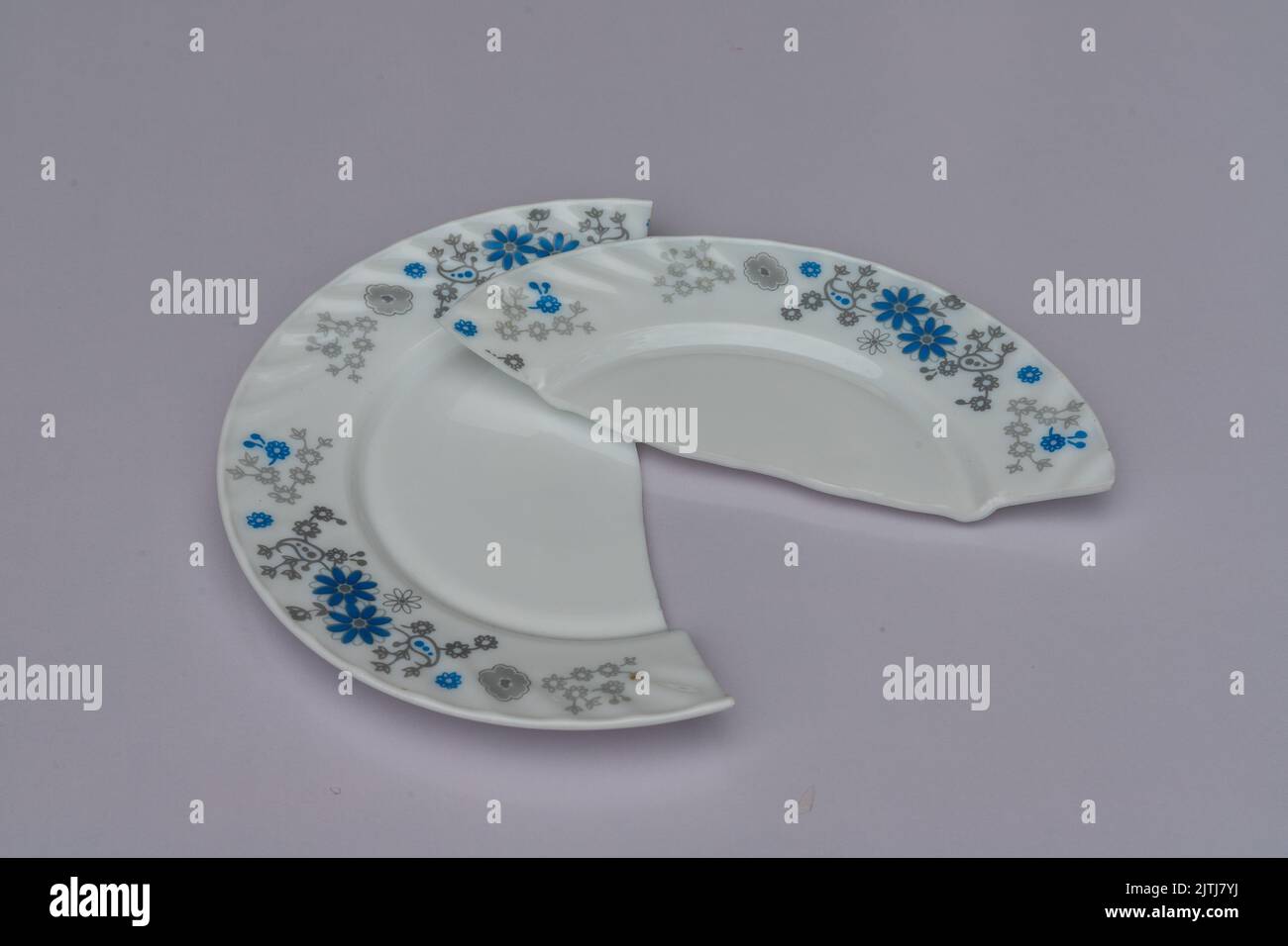 Broken ceramic plate with patterns on isolated white background Stock ...