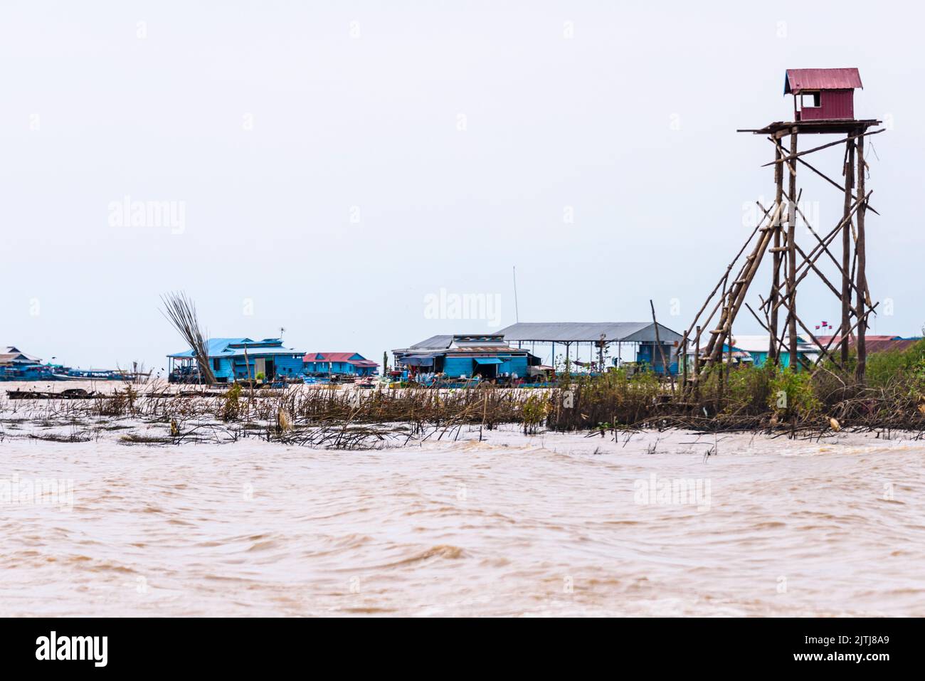 Corrugated iron hut on the top of a tall platform made from bamboo and ...