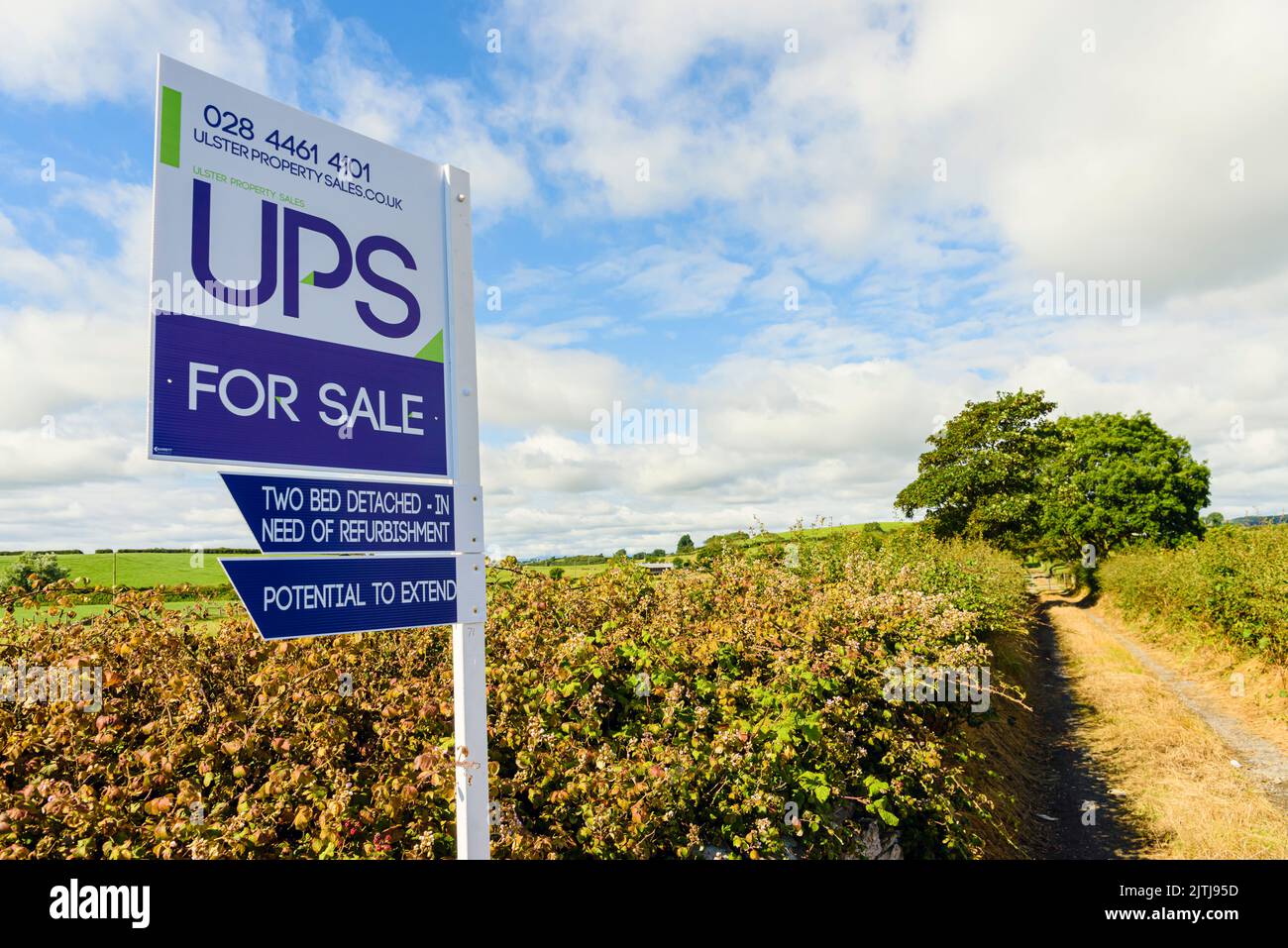 Estate agent sign at the end of a rural lane, advertising a 2 bedroom ...