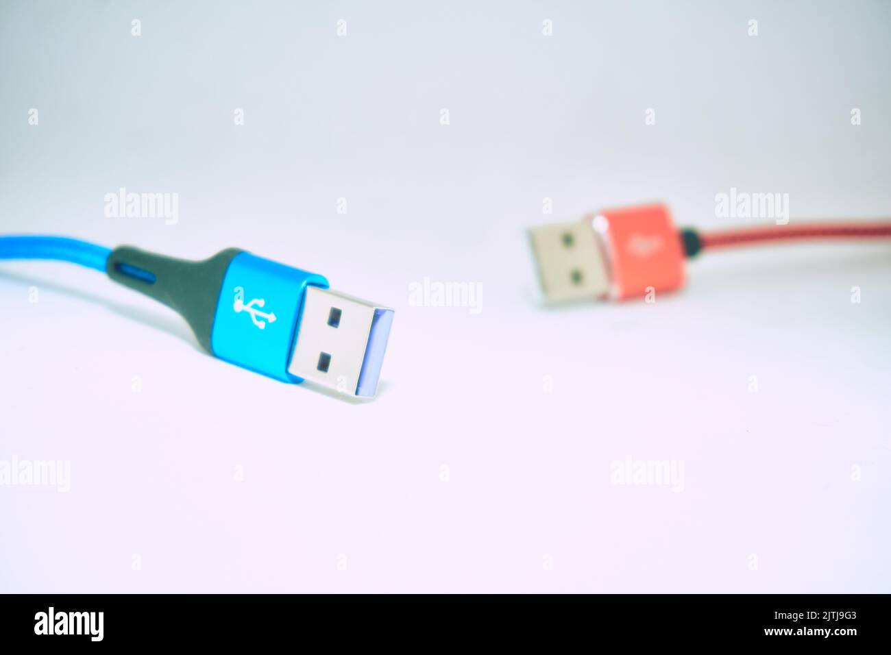 Blue red Universal Serial Bus cables isolated on a gray background ...