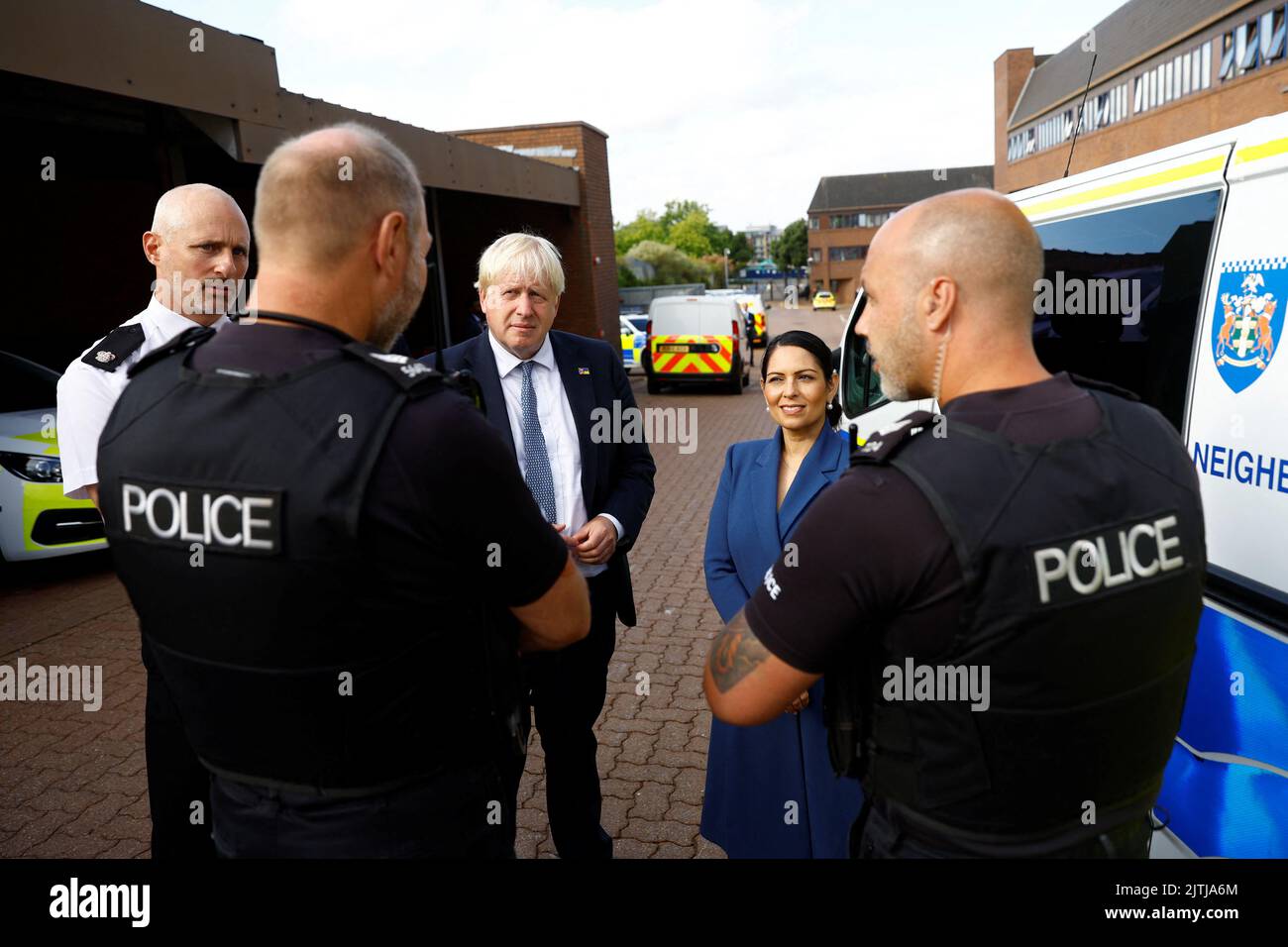Prime Minister Boris Johnson and Home Secretary Priti Patel stand with ...