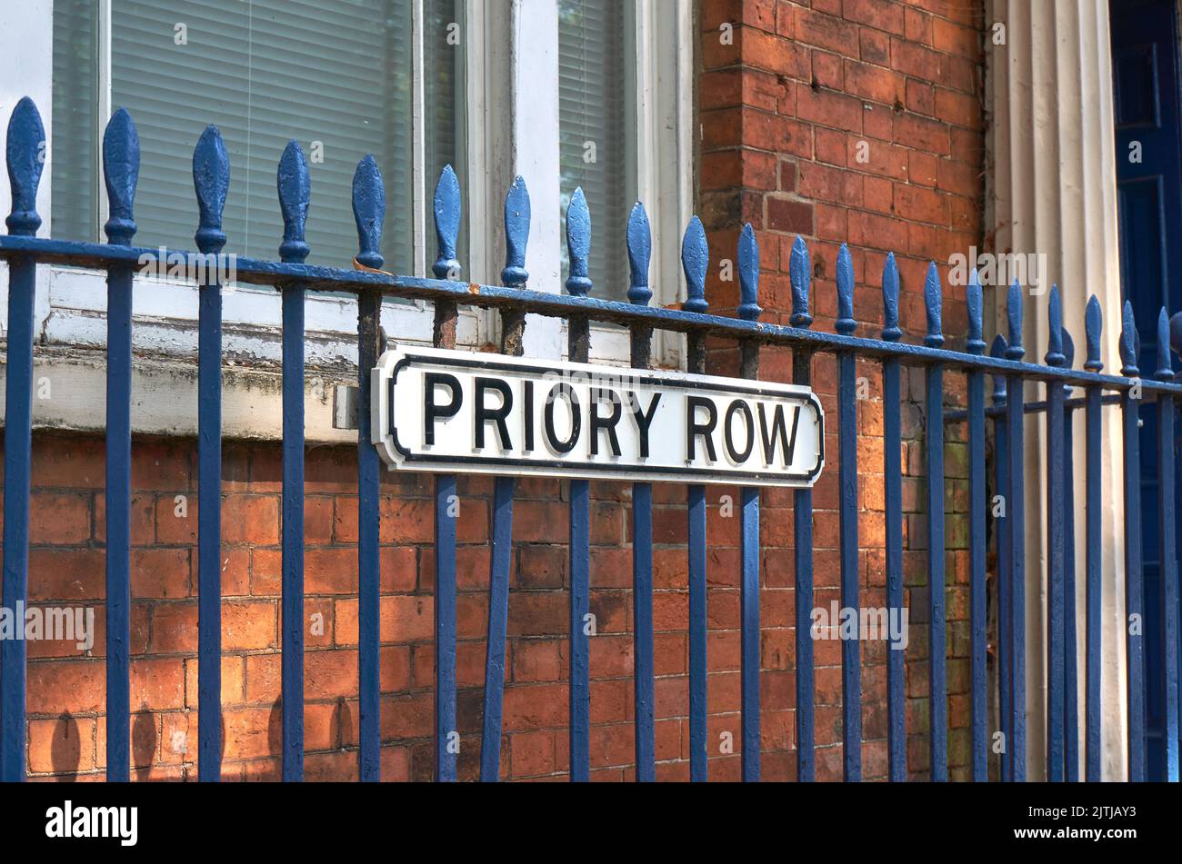 Old street name plate on blue iron railings in Coventry, UK Stock Photo ...