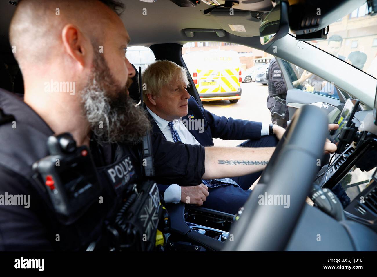 Prime Minister Boris Johnson views an armed response vehicle during a ...