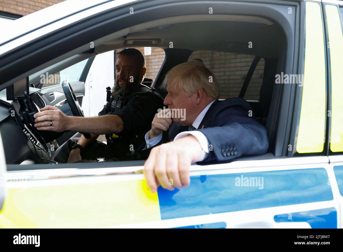 Prime Minister Boris Johnson views an armed response vehicle during a ...