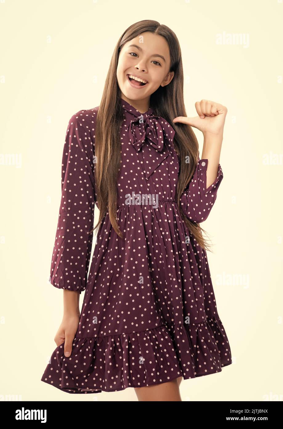 Portrait of happy smiling teenage child girl. Teenager child girl point ...
