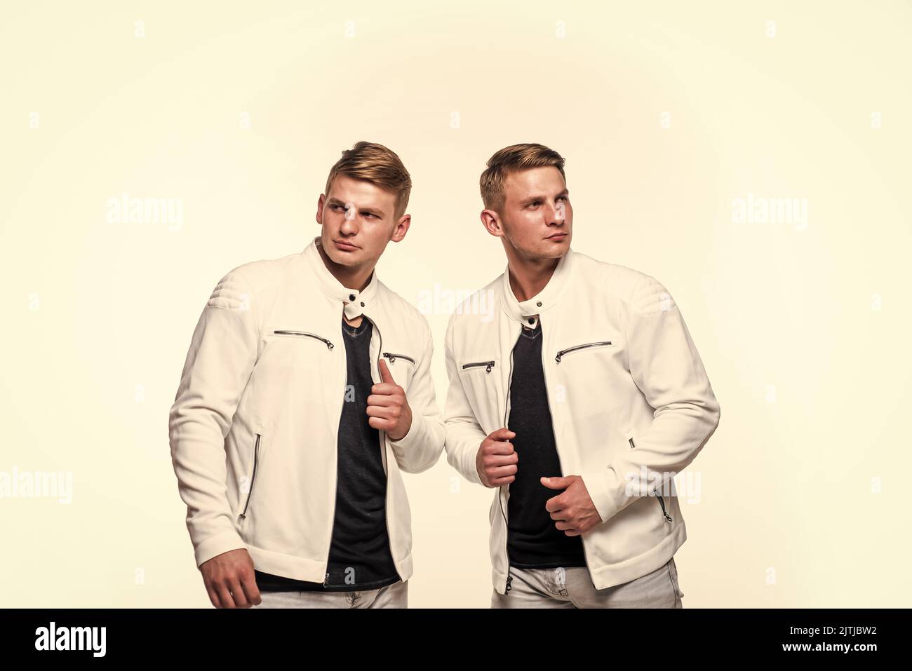 twin brothers men in white casual clothes look alike, male beauty Stock ...