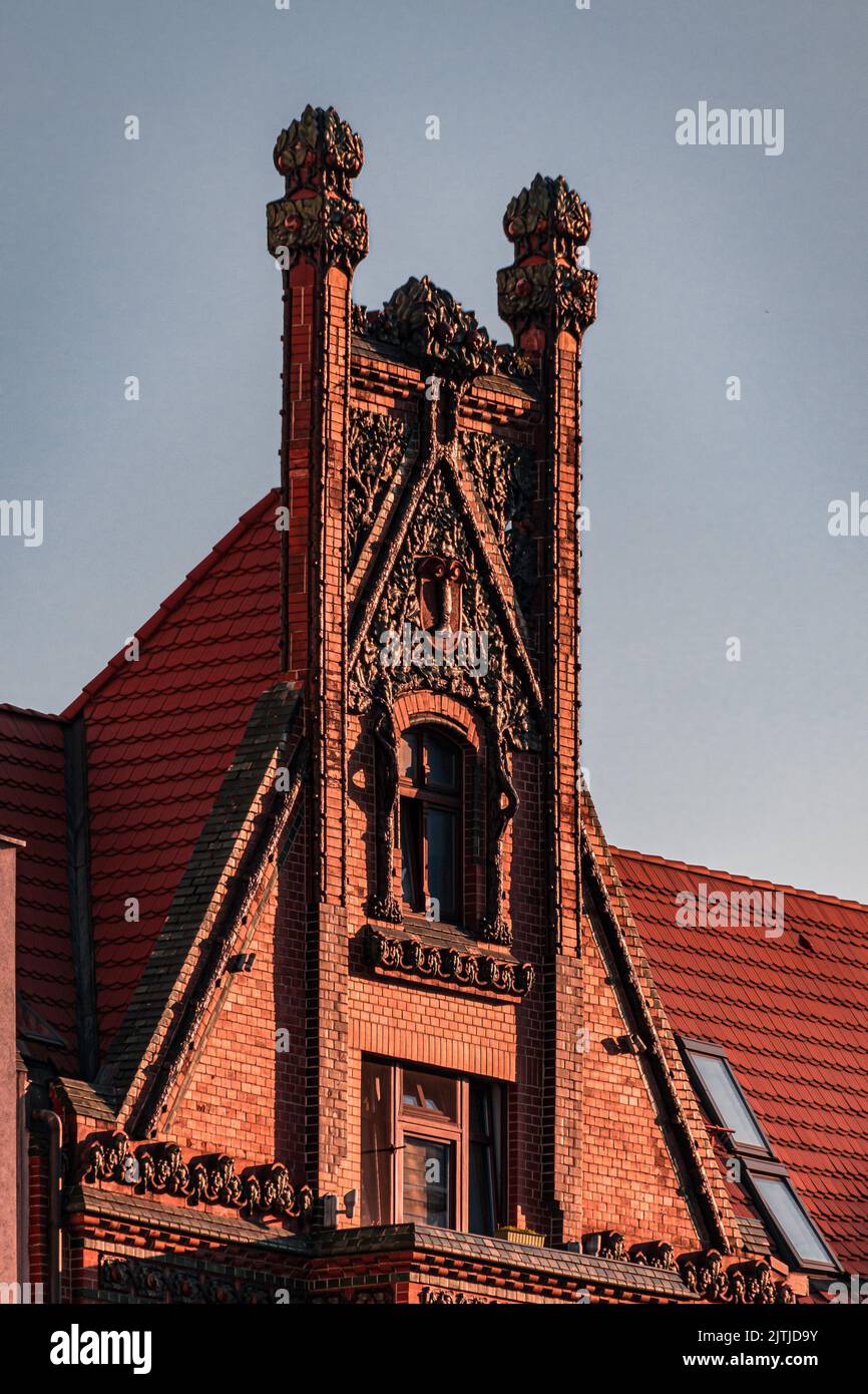 A vertical shot a medieval red brick building Stock Photo - Alamy