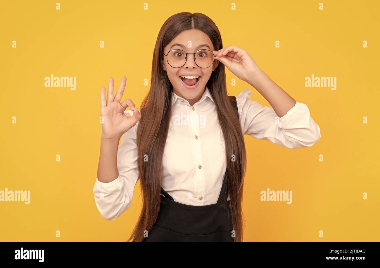 surprised kid in school uniform and glasses for vision protection ...