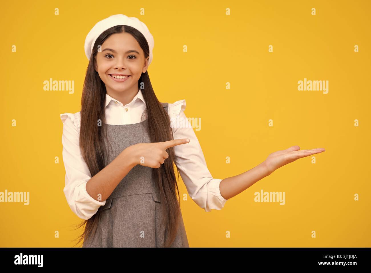 Look at advert. Teenager child points aside shows blank copy space for ...