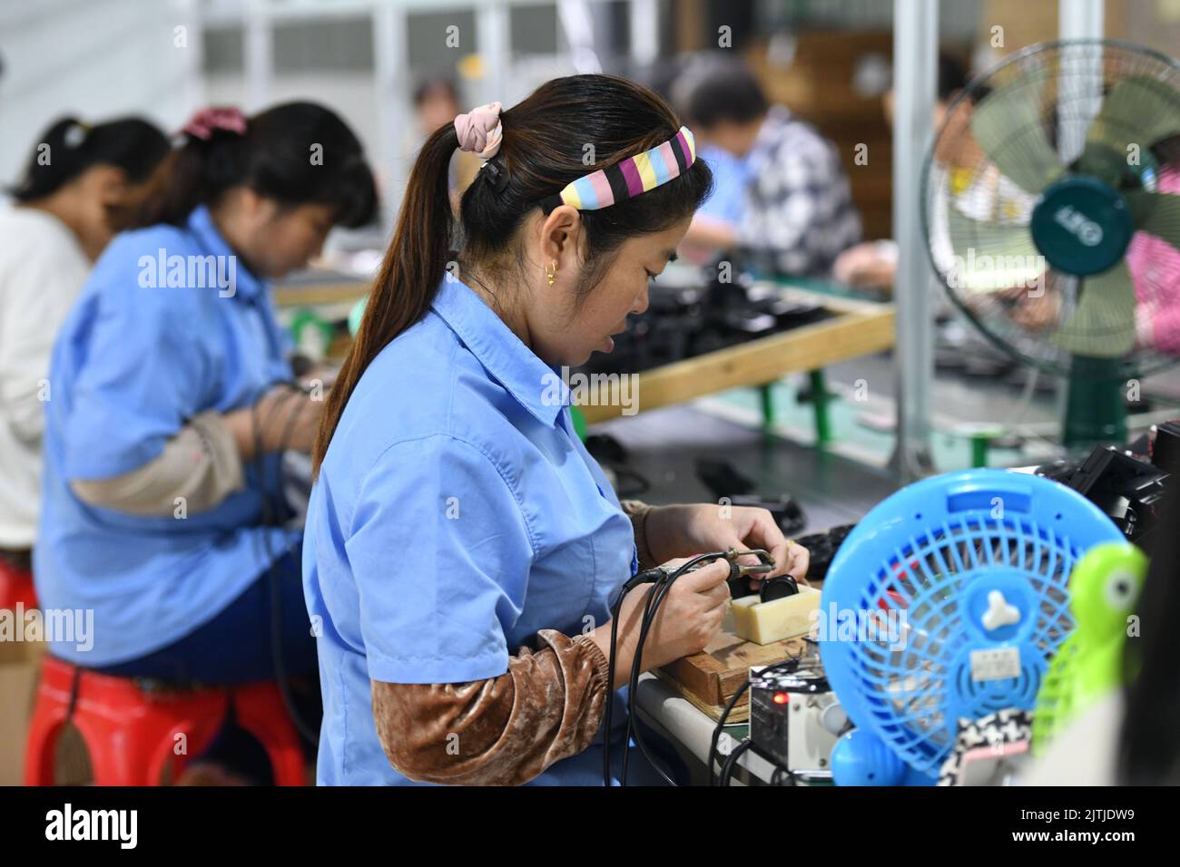 FUYANG, CHINA - AUGUST 31, 2022 - Workers work on the speaker ...