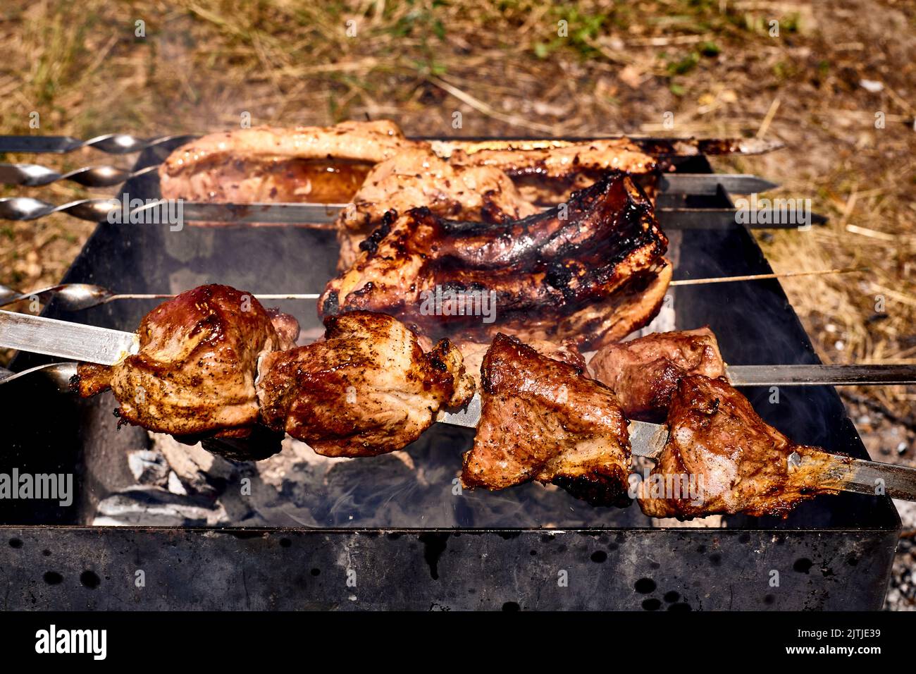 Delicious piece of meat pork beef fried over the fire mangal at a ...