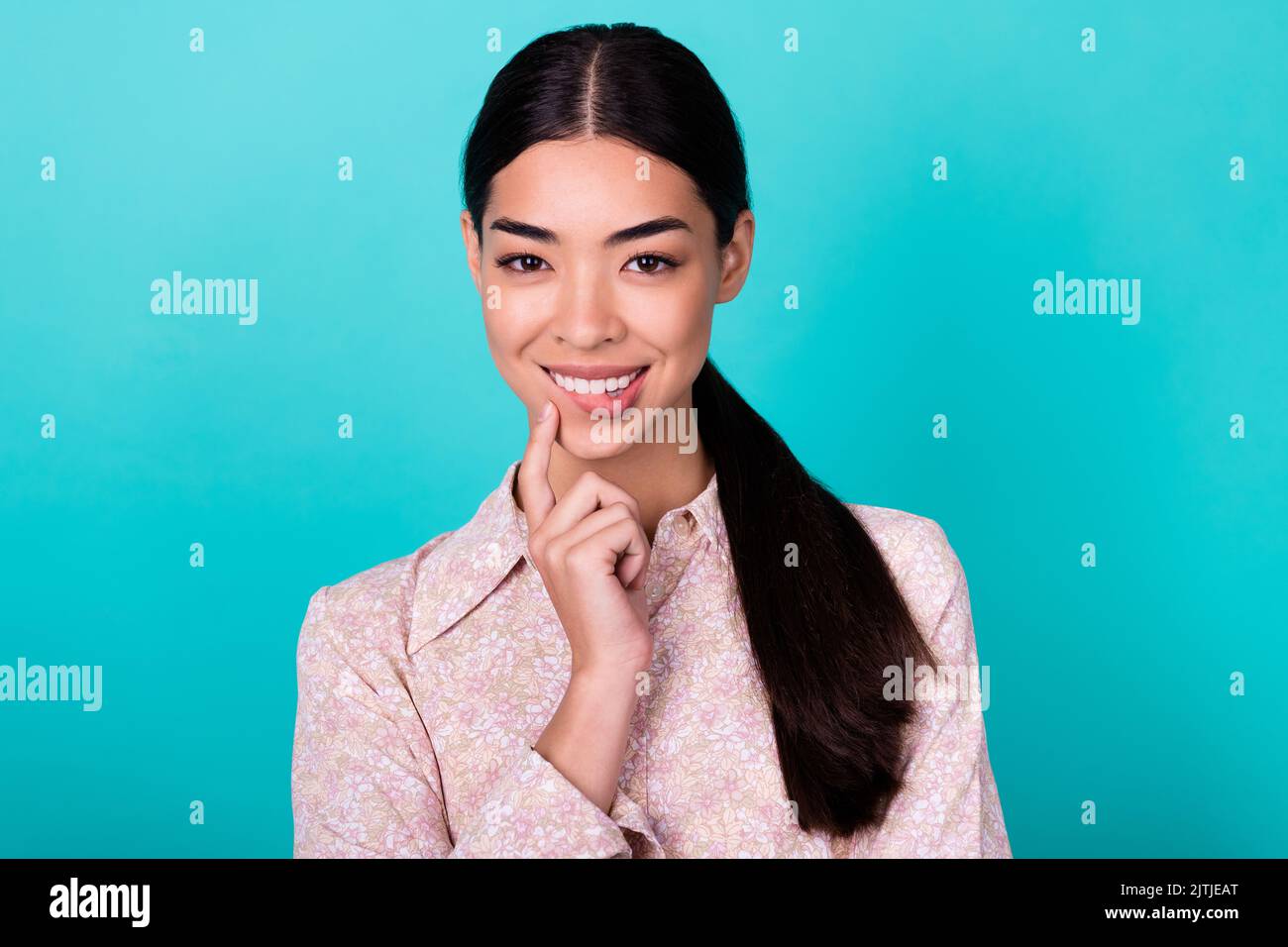 Photo of cheerful pretty girl finger touch chin biting lips ...