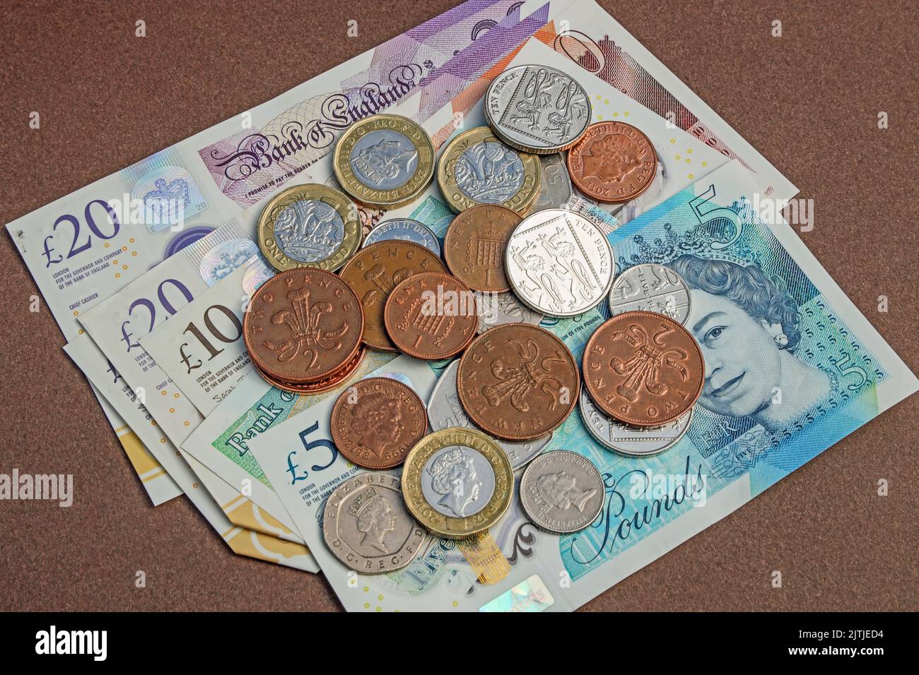 British bank notes and cash. Talk of loose cash disappearing by card ...