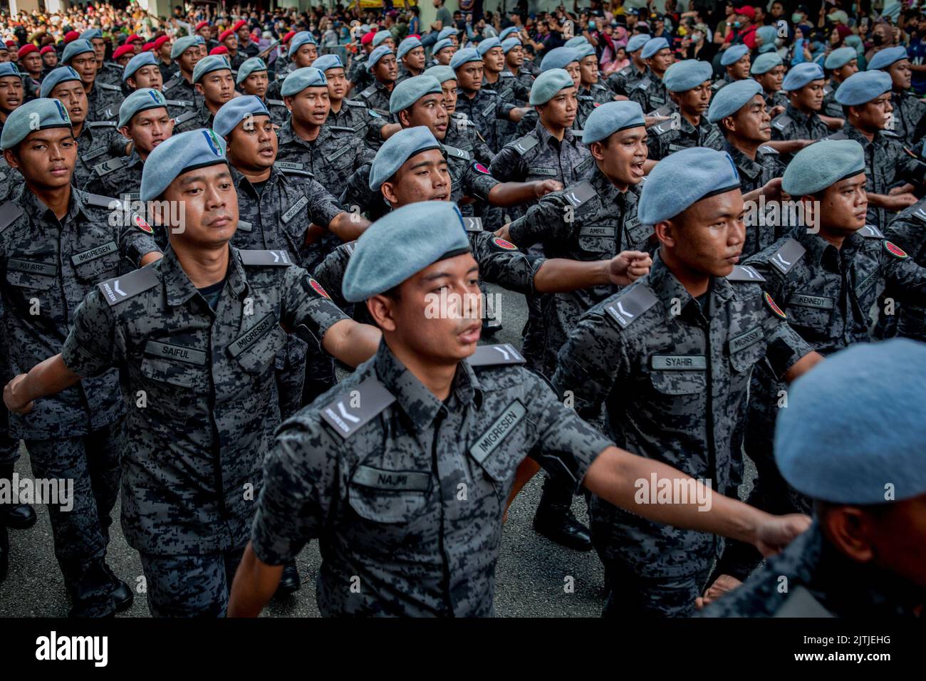 A group of Uniformed Security Forces march in front of the crowd during ...