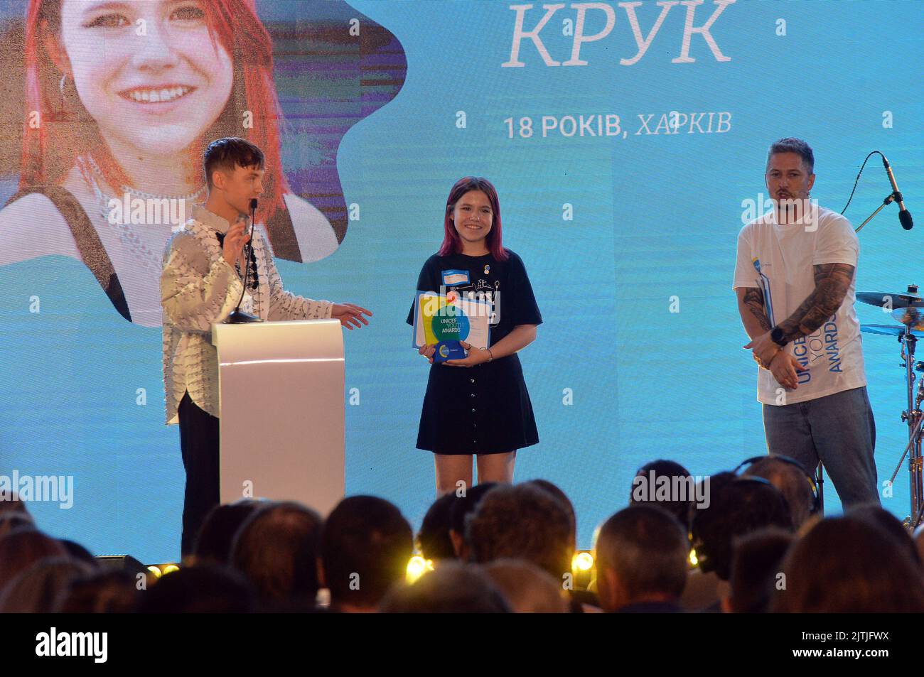KYIV, UKRAINE - AUGUST 30, 2022 - Ukrainian singer Artem Pivovarov (L) gives the prize to Daryna ...