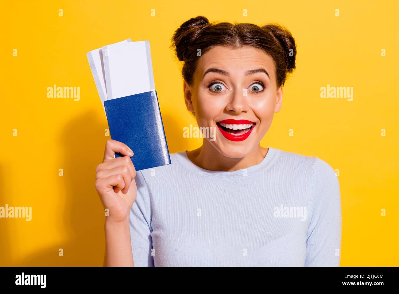 Photo of surprised shocked positive lady win two tickets on air plane ...