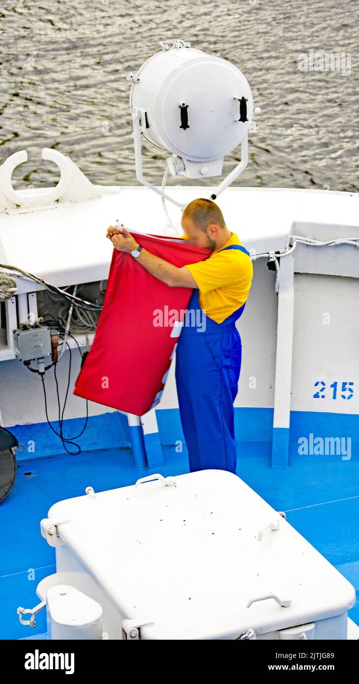 Preparing to hoist the flag hi-res stock photography and images - Alamy