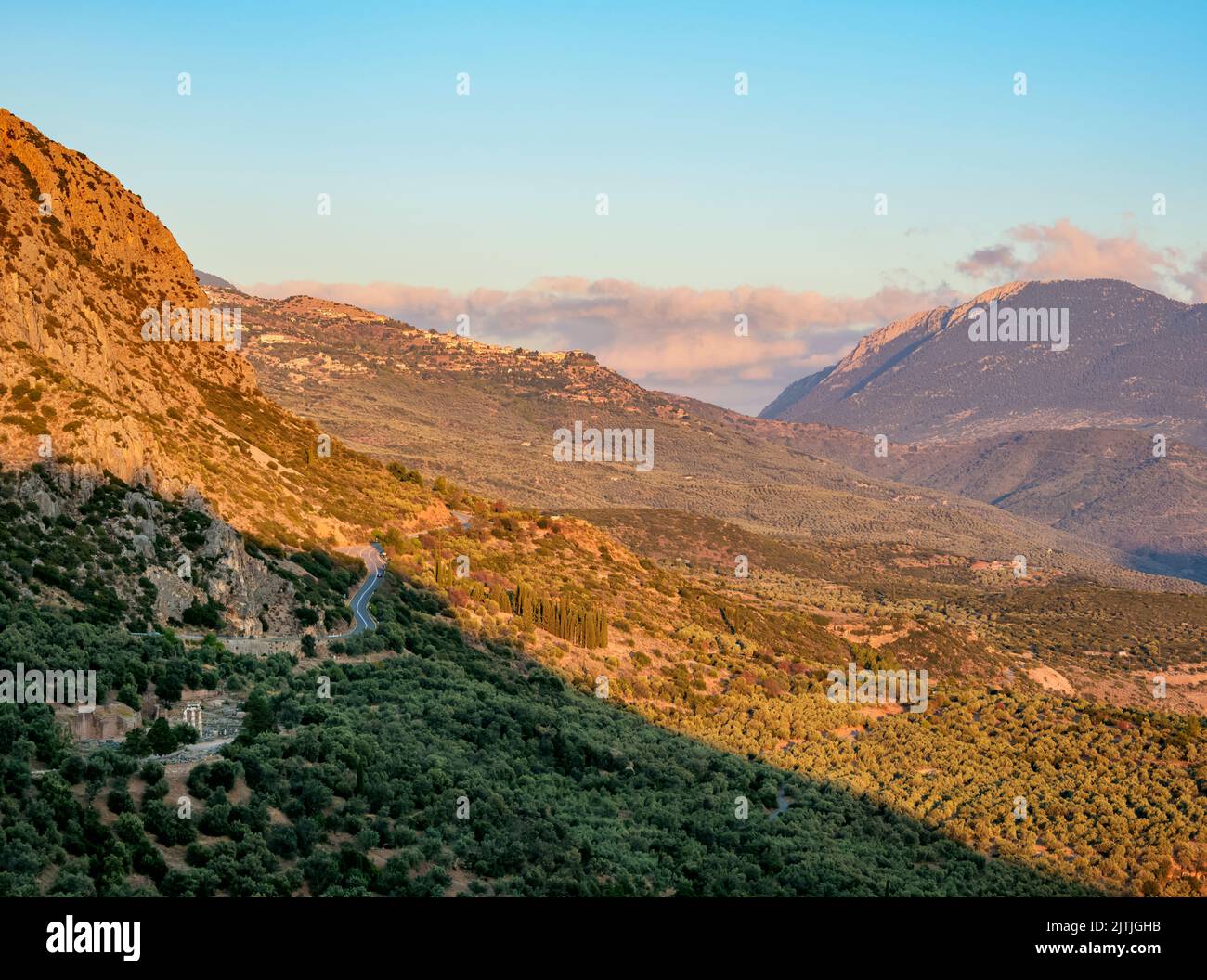 View towards the Tholos of Delphi, Temple of Athena Pronaia, sunset ...