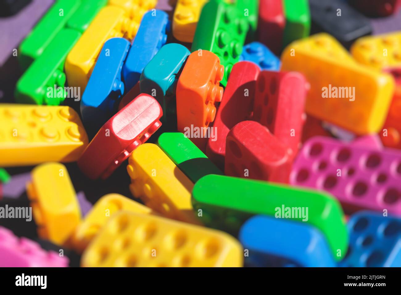 Children play colorful big toy blocks in kindergarten day care center ...