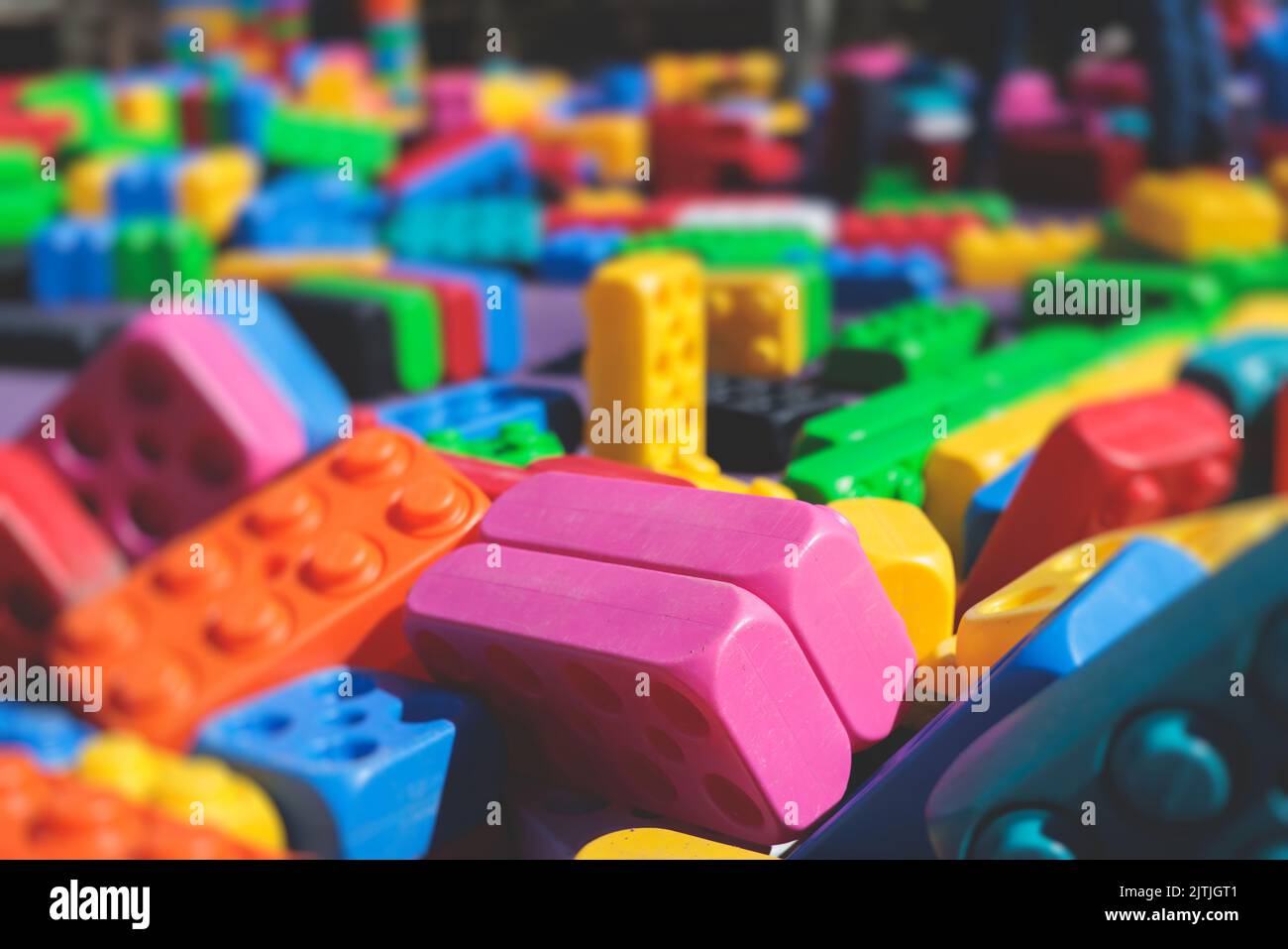 Children play colorful big toy blocks in kindergarten day care center ...