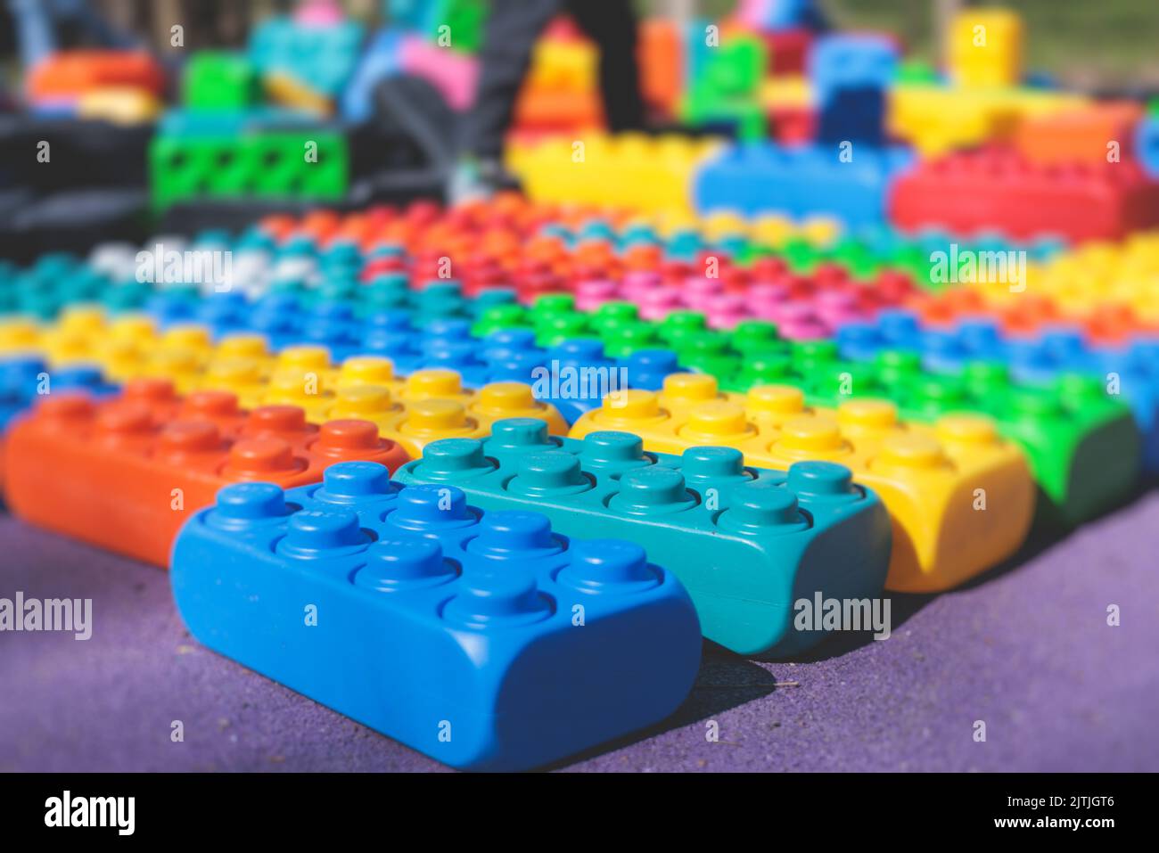 Children play colorful big toy blocks in kindergarten day care center ...