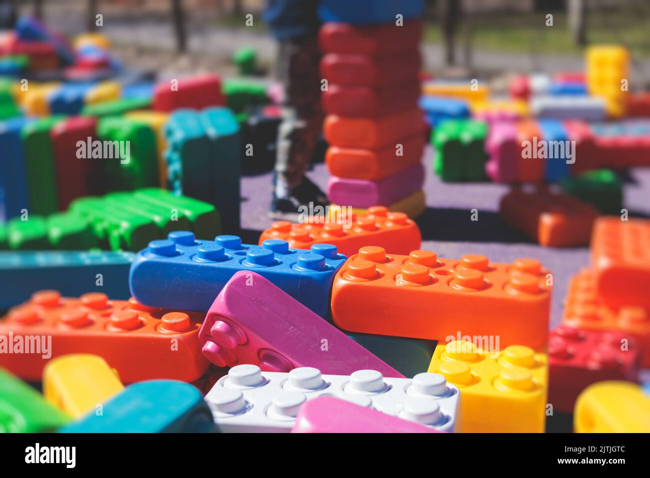 Children play colorful big toy blocks in kindergarten day care center ...