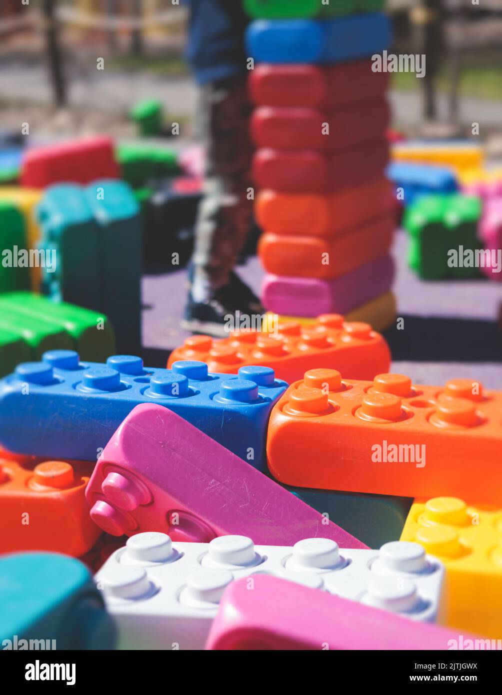 Children play colorful big toy blocks in kindergarten day care center ...