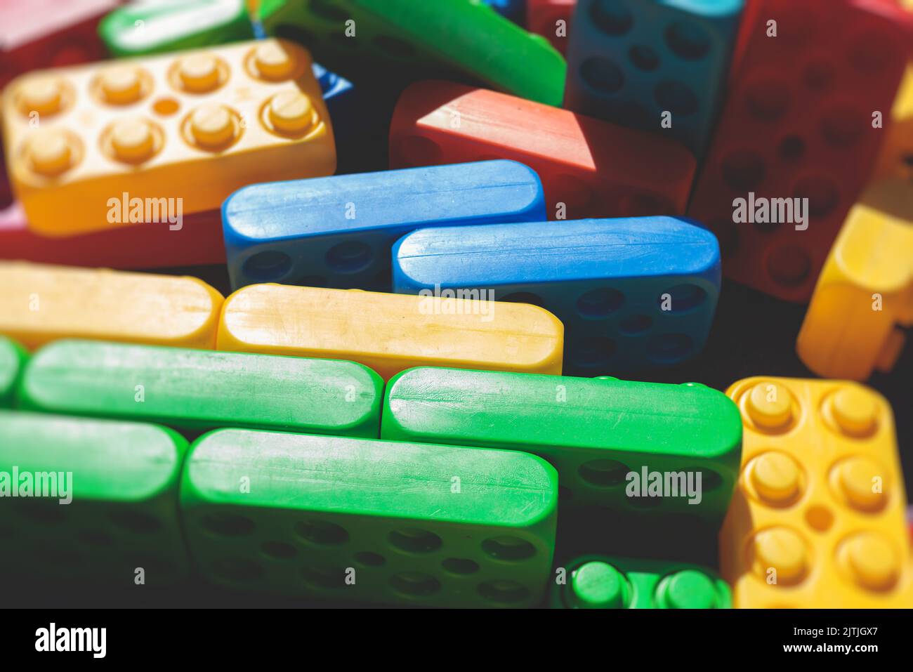 Children play colorful big toy blocks in kindergarten day care center ...