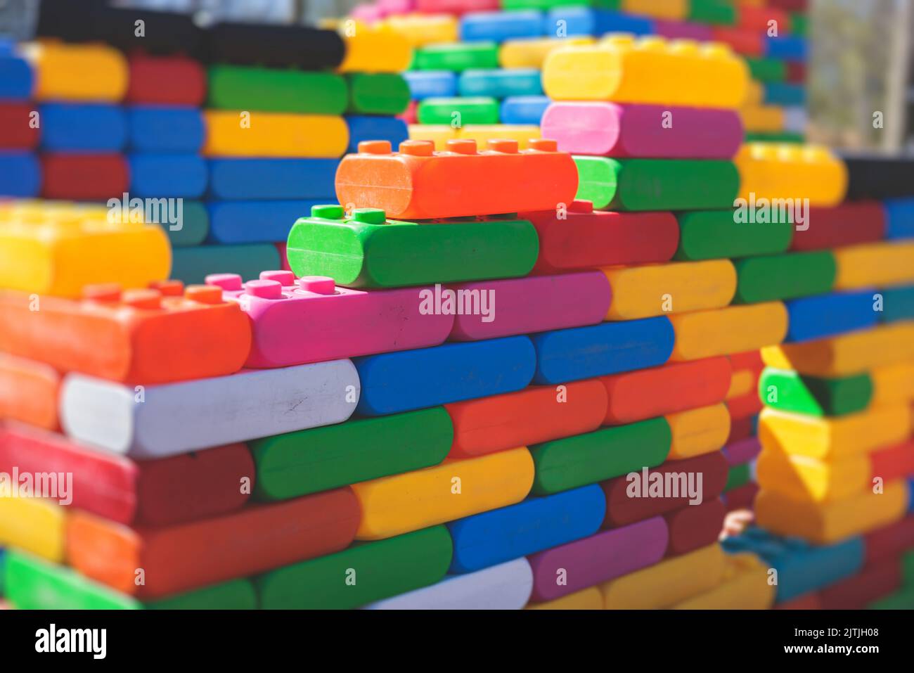 Children play colorful big toy blocks in kindergarten day care center ...