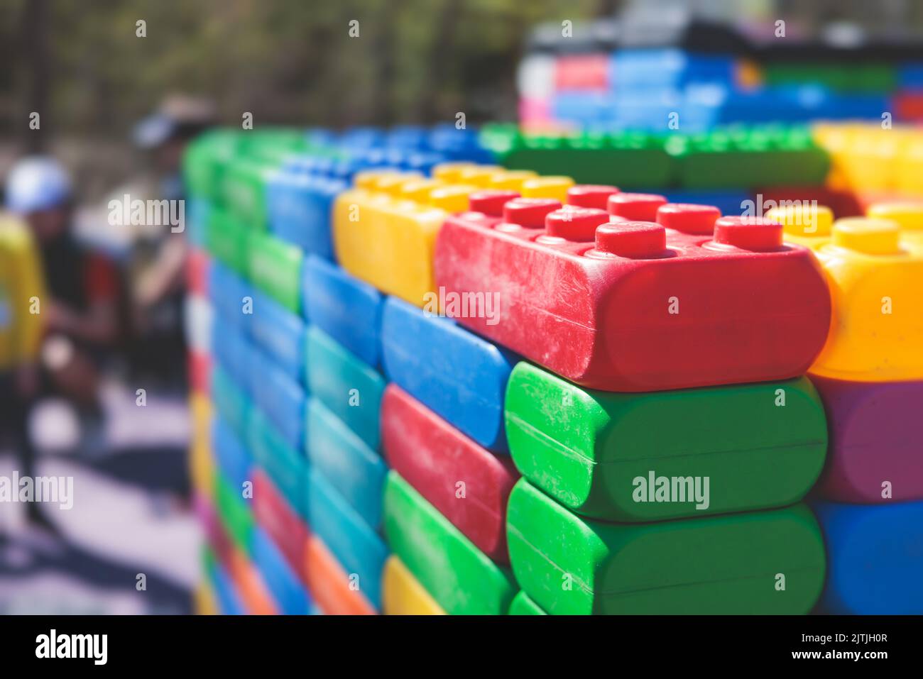 Children play colorful big toy blocks in kindergarten day care center ...