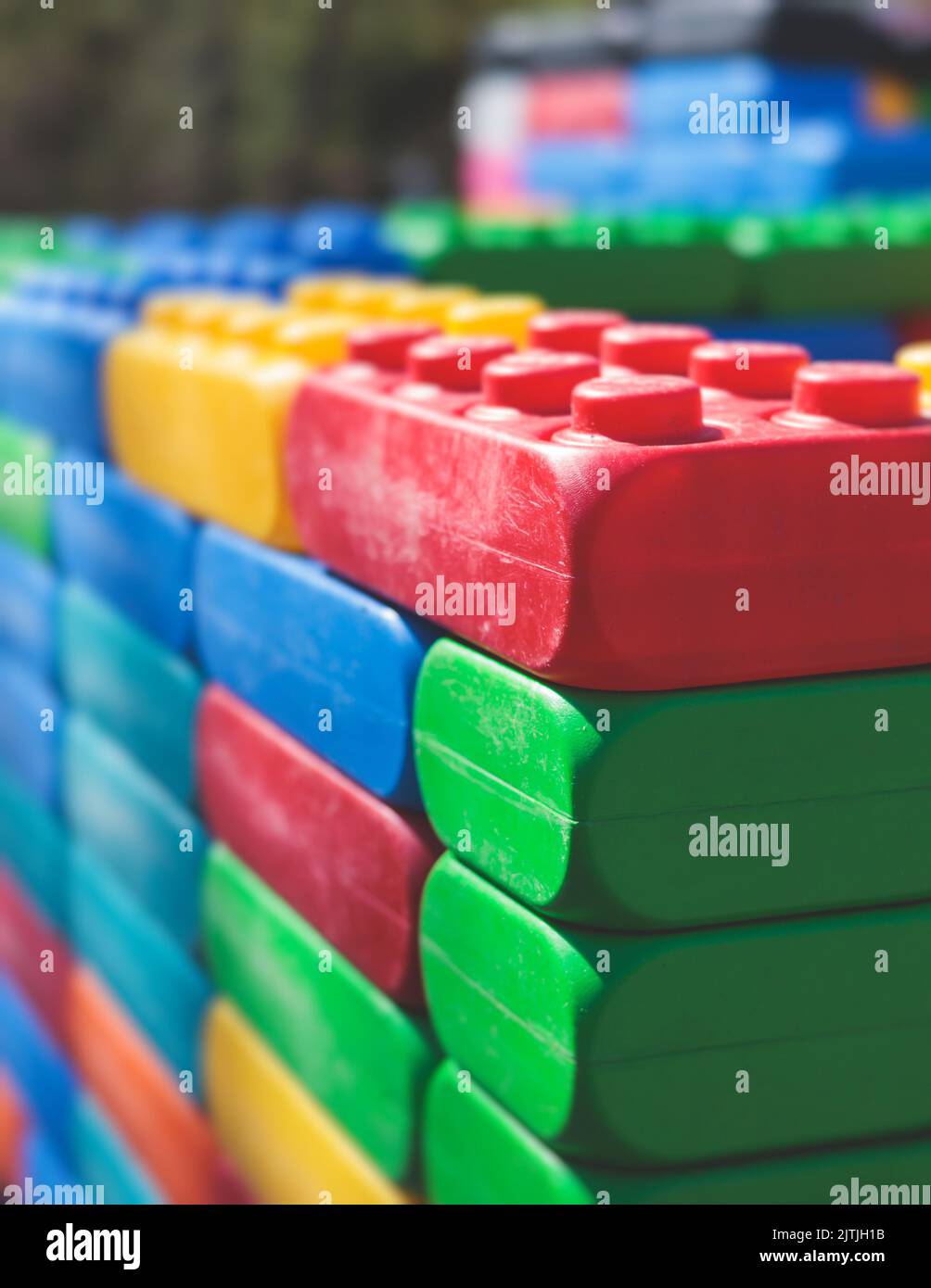 Children play colorful big toy blocks in kindergarten day care center ...