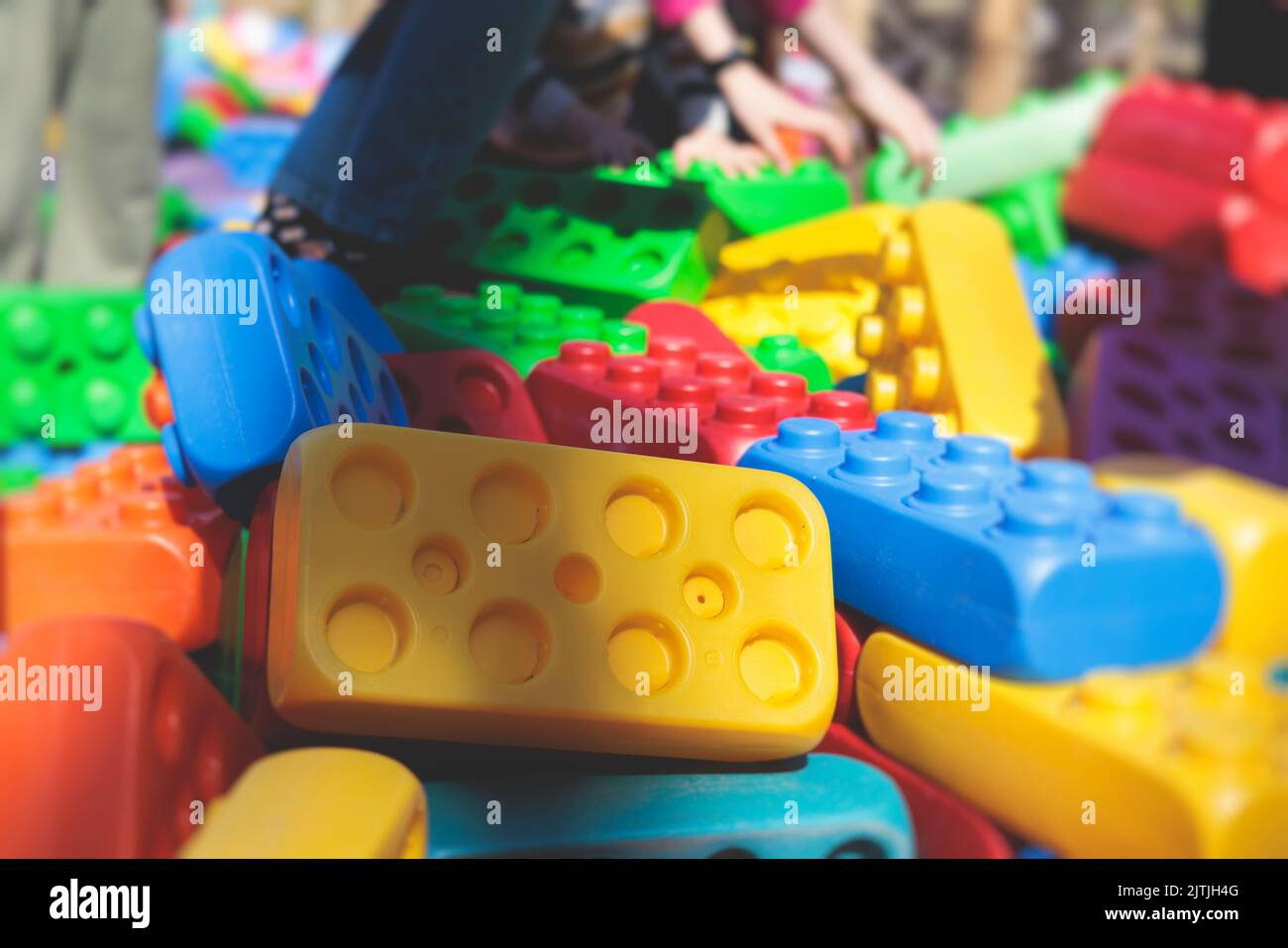 Children play colorful big toy blocks in kindergarten day care center ...