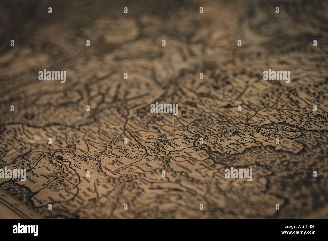 A selective focus shot of an old ancient map of Scotland in the UK ...